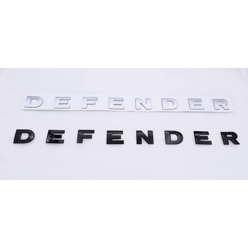 EMBLEMA DELANTERO O TRASERO LETRAS DEFENDER GRIS